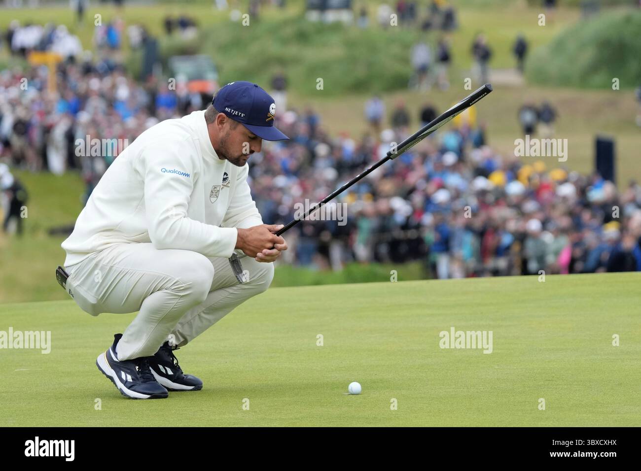 Bryson DeChambeau of the United States looks at the line of his putt on ...
