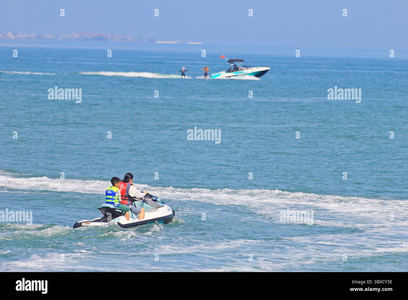 Tourists enjoy summer time in Sanya City, southernmost China's Hainan ...
