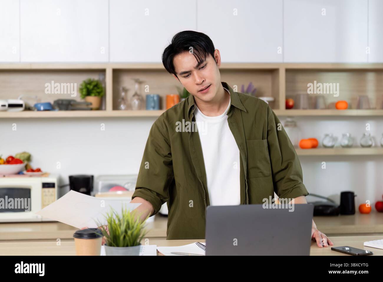 Reviewing documents laptop remote hi-res stock photography and images ...