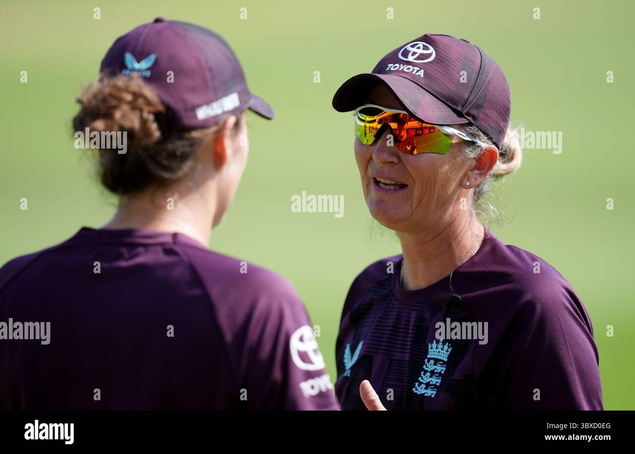England head coach Charlotte Edwards speaks with England's Nat Sciver ...