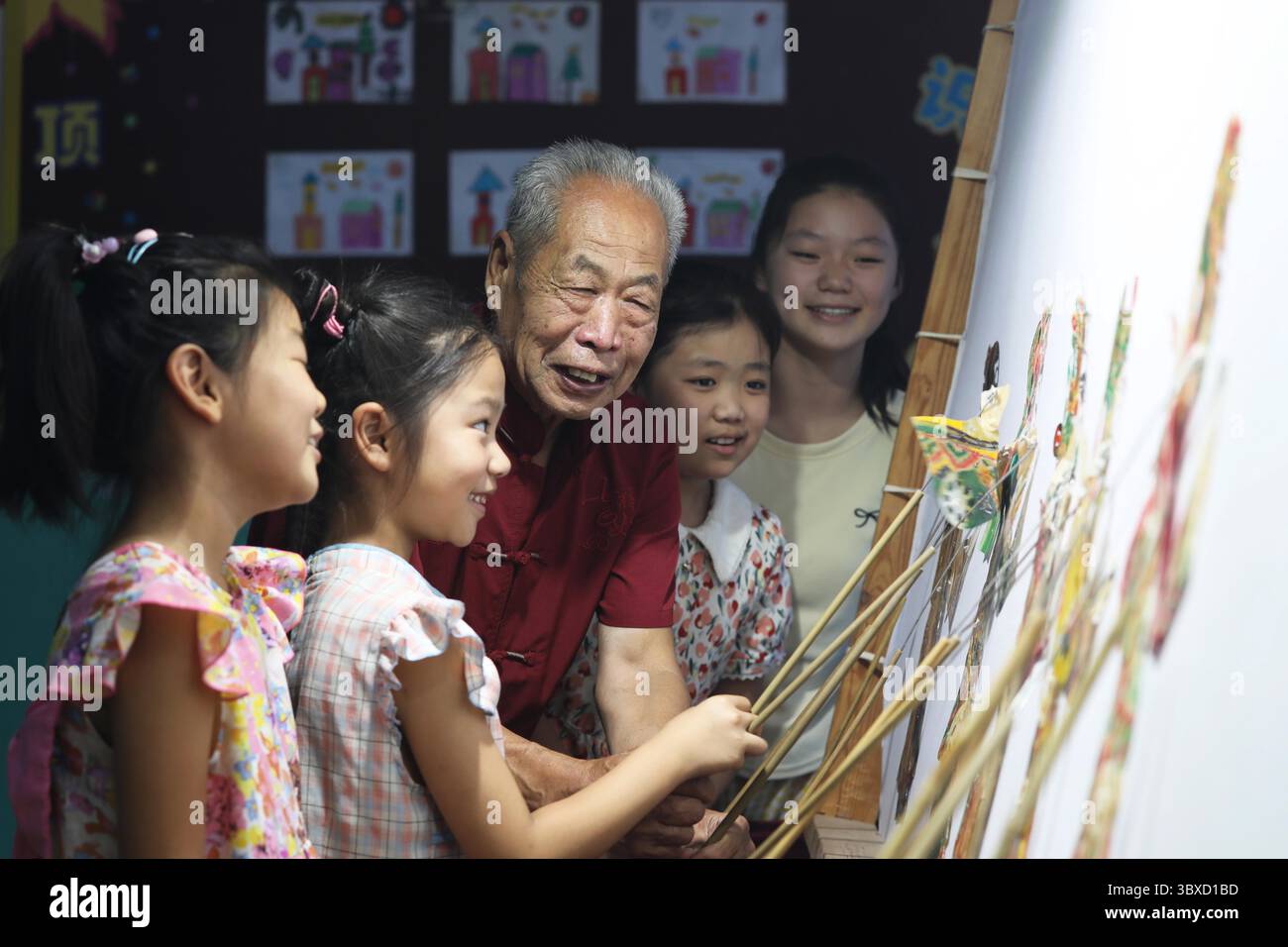 Pupils experience the shadow puppet play in Tangshan City, north China ...