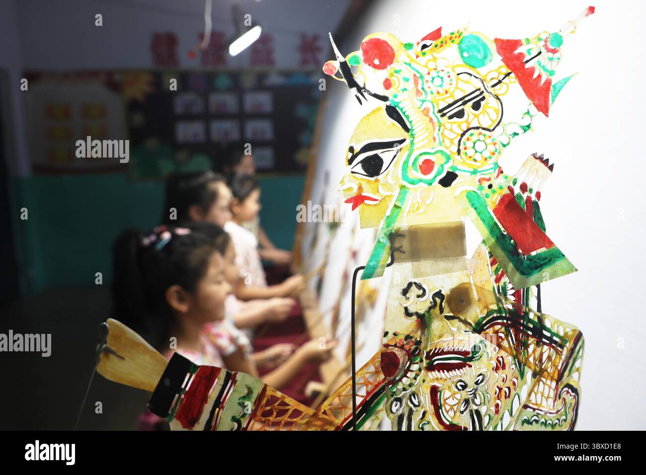 Pupils experience the shadow puppet play in Tangshan City, north China ...