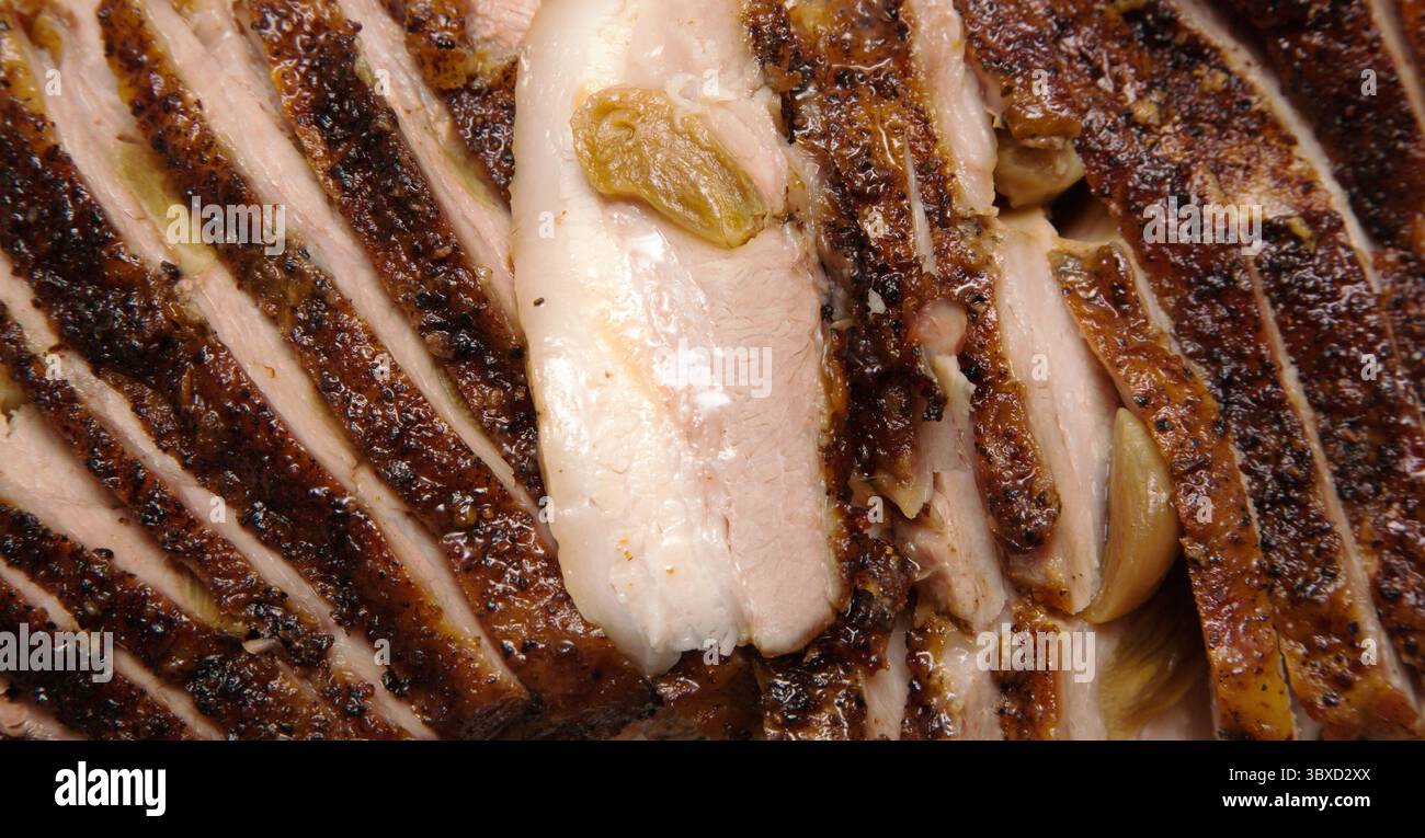 Baked boiled pork cut into neat pieces on a platter Stock Photo - Alamy