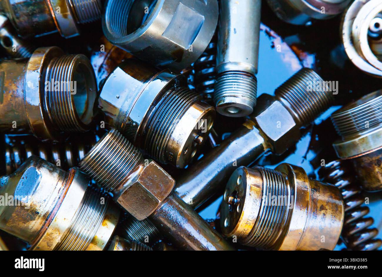 Details of the ship's main engine in oil close-up. Nozzles, bushings ...