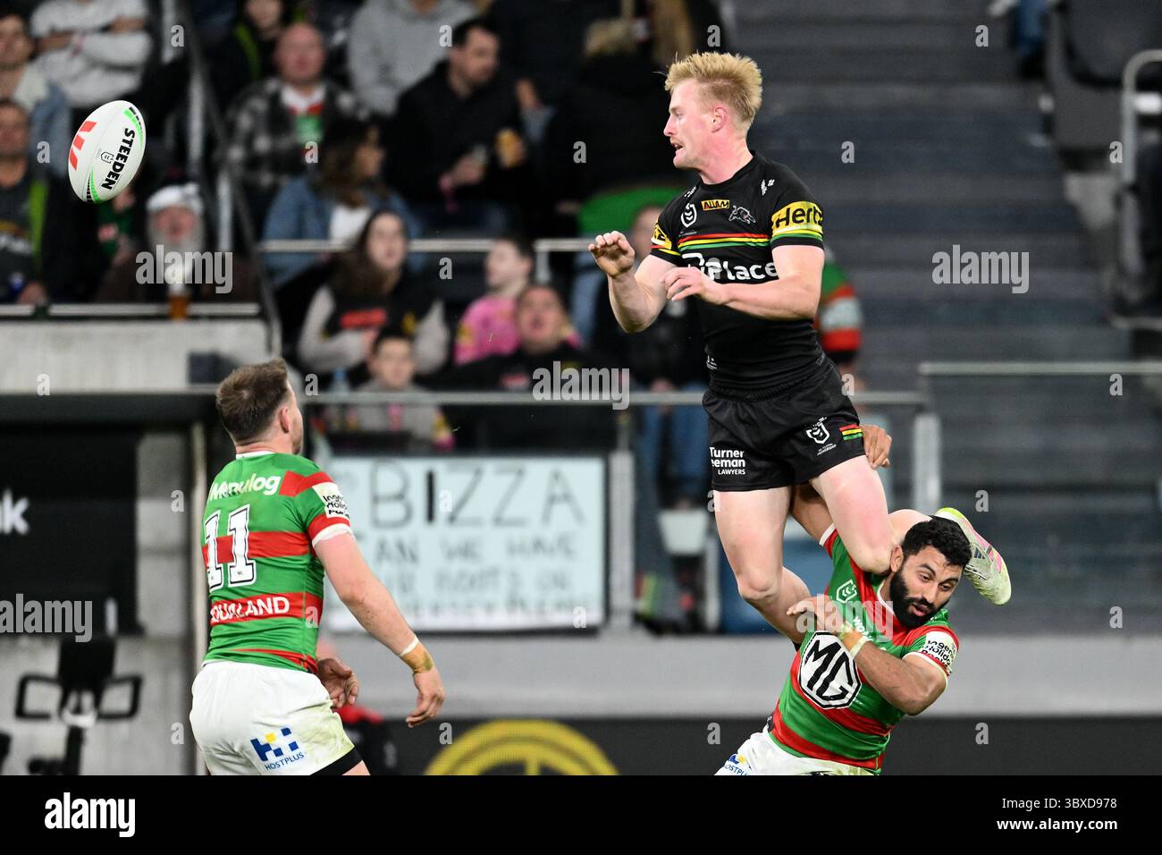 Thomas Jenkins of the Panthers goes high above Alex Johnston of the ...