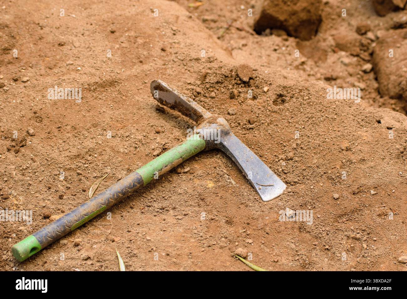 Pickaxe Tool Lying on the Ground at a Dig Site Stock Photo - Alamy