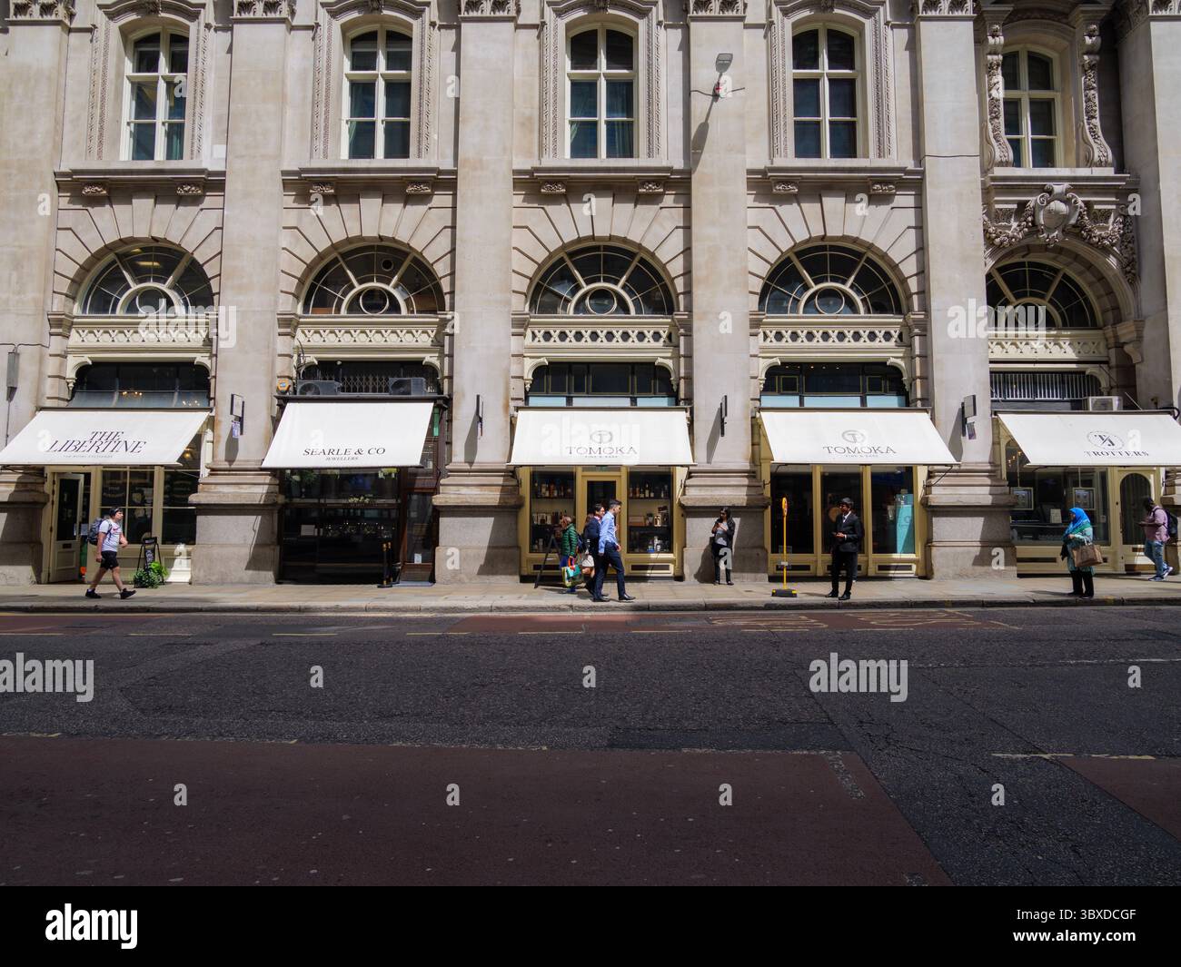 Luxury retail boutiques line the exterior of the Royal Exchange in the ...