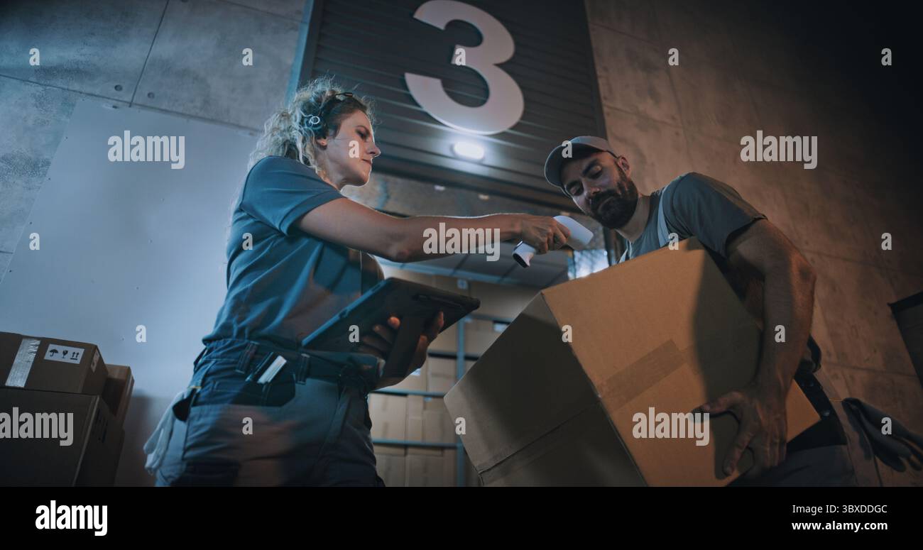 Woman scanning barcode from boxes hi-res stock photography and images ...