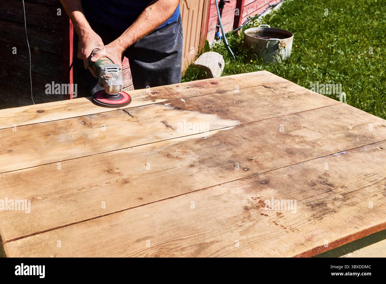 Grinding wood tabletop with handheld angle grinder, sanding disc ...