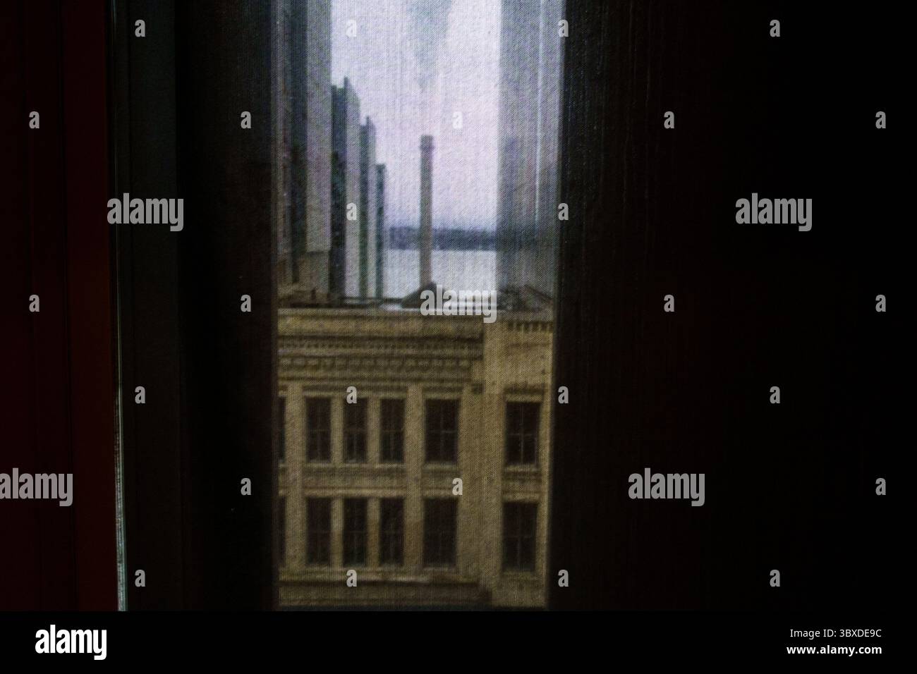 Buildings seen through a window with a fine mesh screen Stock Photo - Alamy