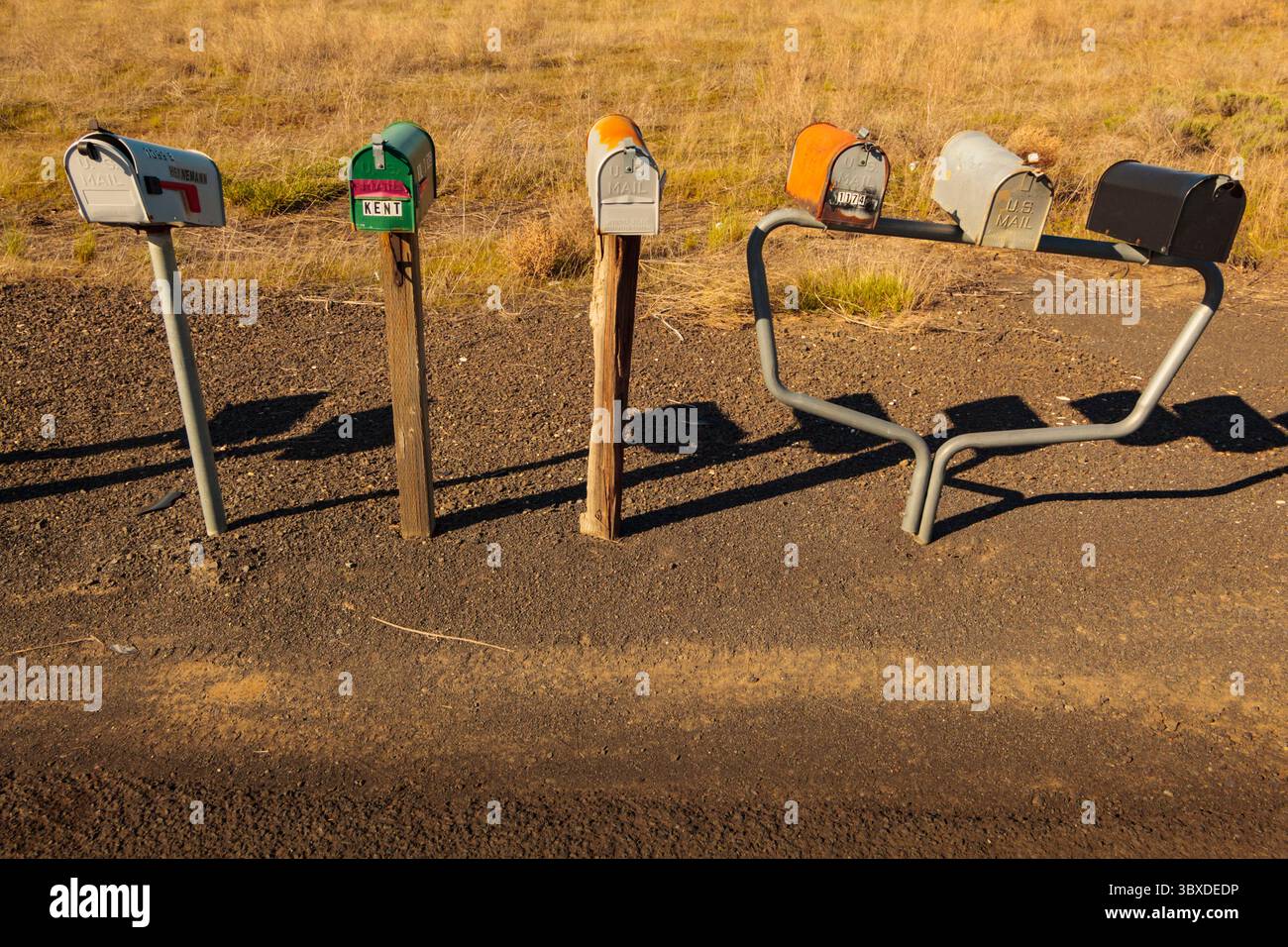 Rural route mail boxes on posts by the roadside Stock Photo - Alamy