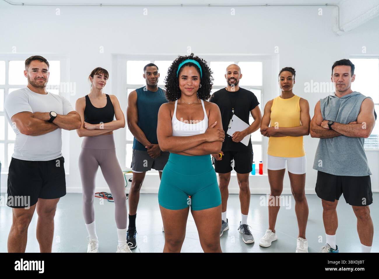 Multiethnic group of sportive people doing functional workout in ...