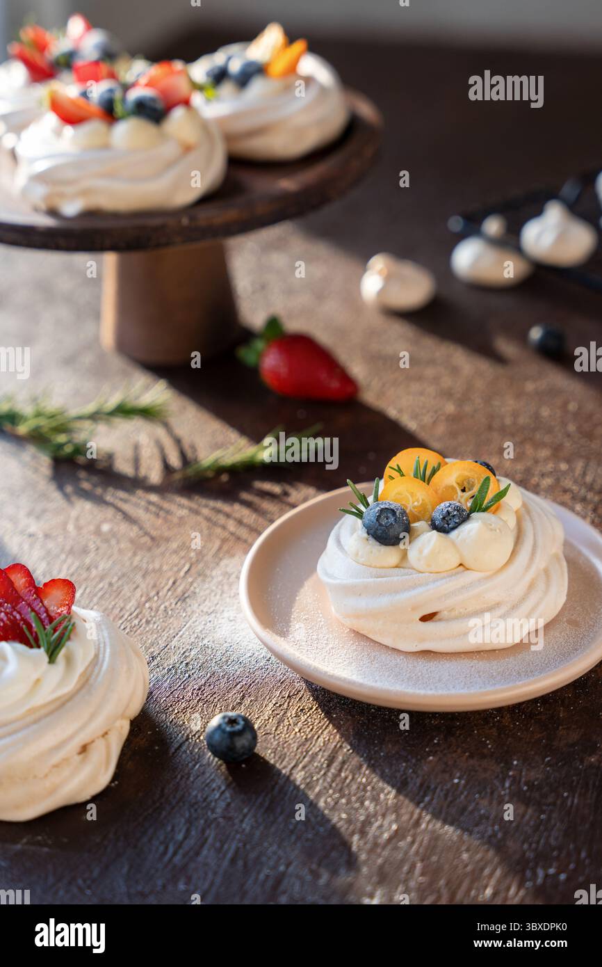 Rustic Style Mini Pavlova Desserts with Summer Fruits Stock Photo - Alamy