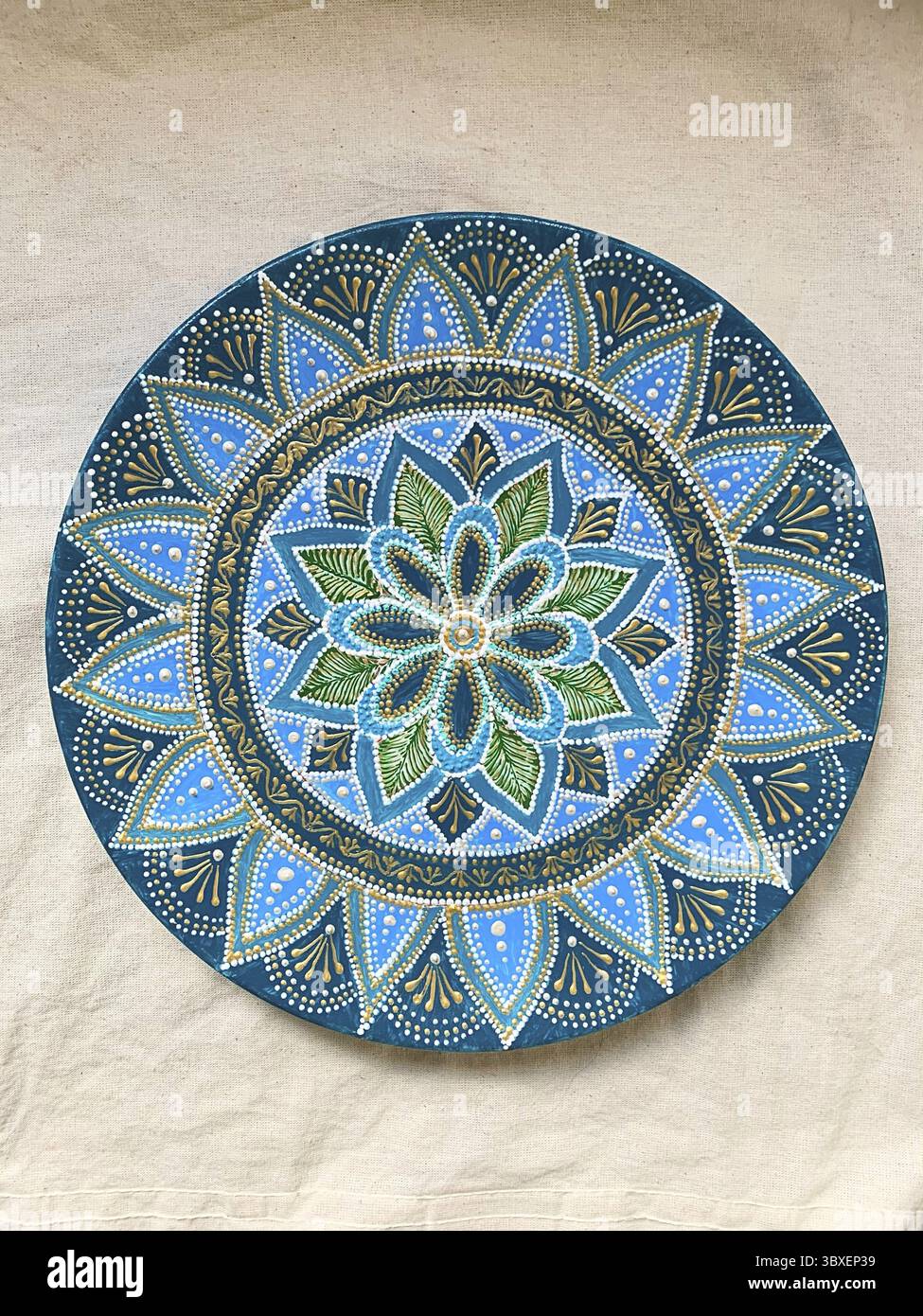 Decorative ceramic plate with different colors. painted plate on white ...