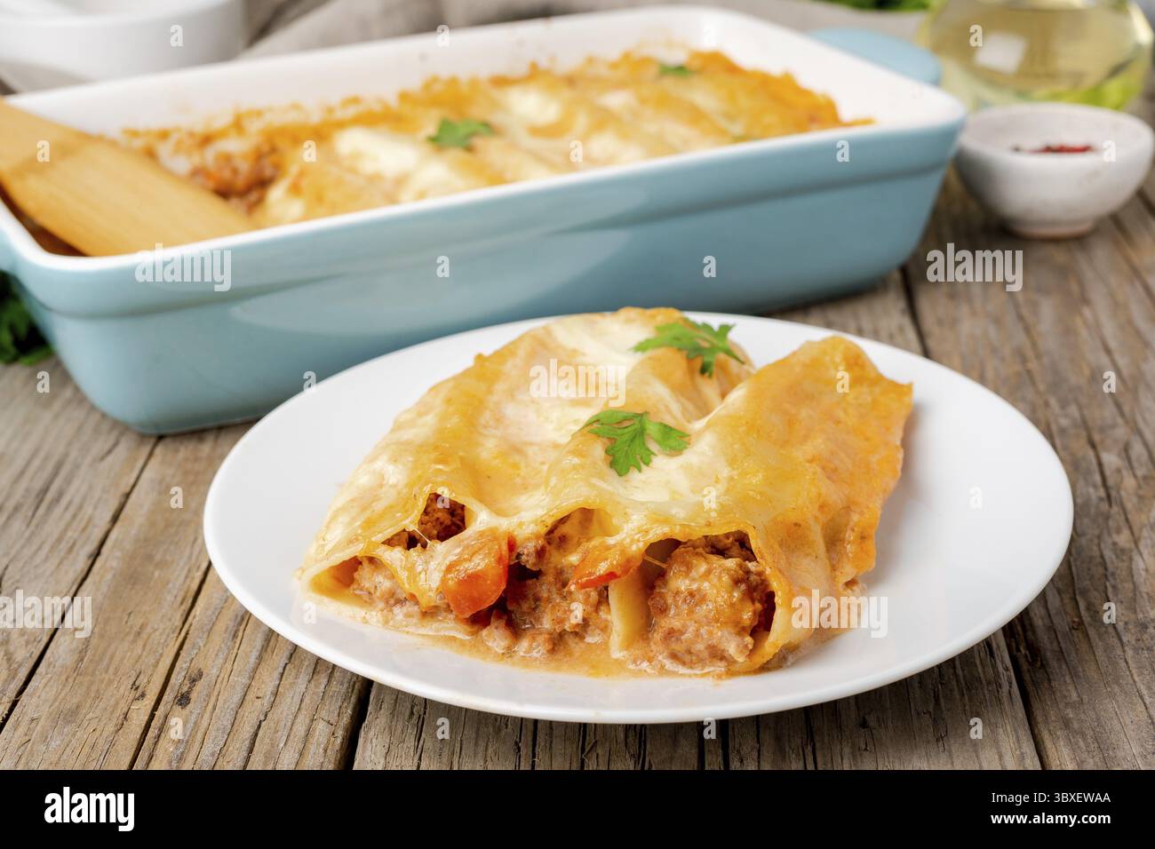 Cannelloni with filling of ground beef, tomatoes, baked with bechamel ...