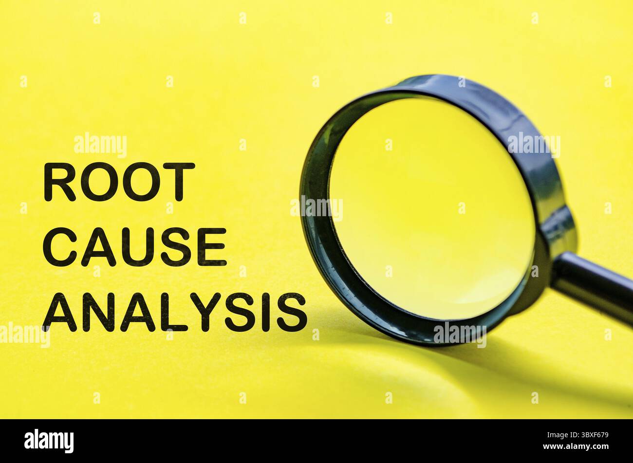 Root Cause Analysis text on yellow cover with magnifying glass ...