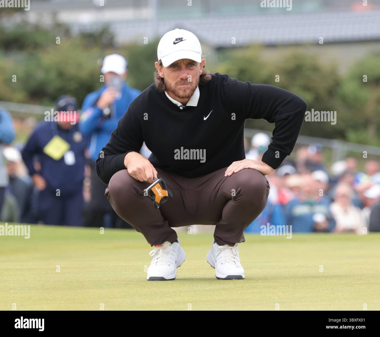 Great Britain's Tommy Fleetwood lines up a putt during the Second round ...