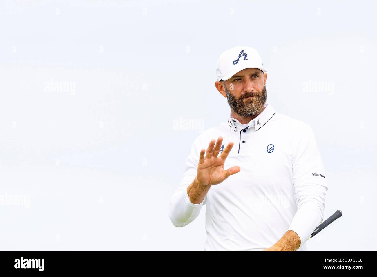 Captain Dustin Johnson of 4Aces GC waves during the second round of The ...