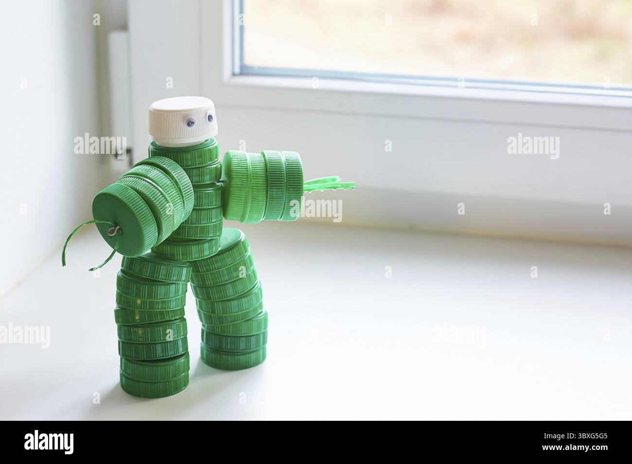 Recycling art. Zero waste, the second life of things. Toy robot made of ...