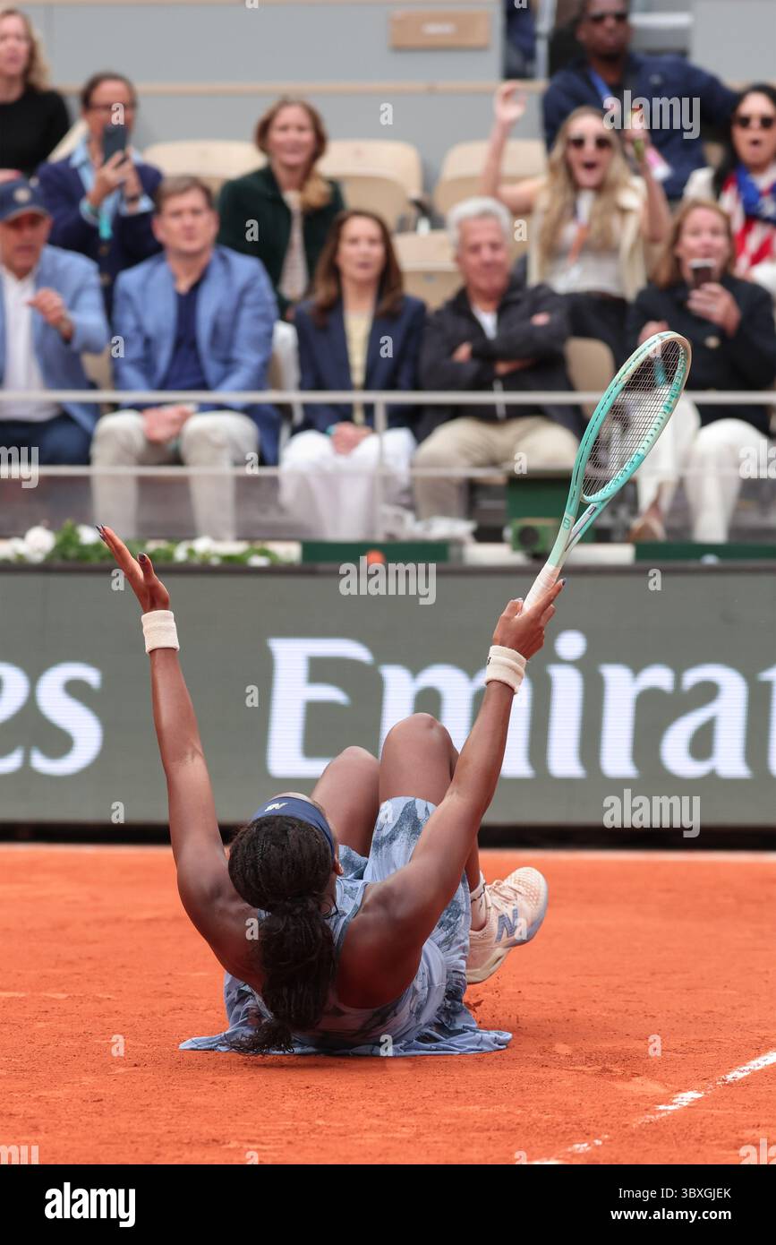 American tennis player Coco Gauff falling to the ground celebrating her win at the French Open ...