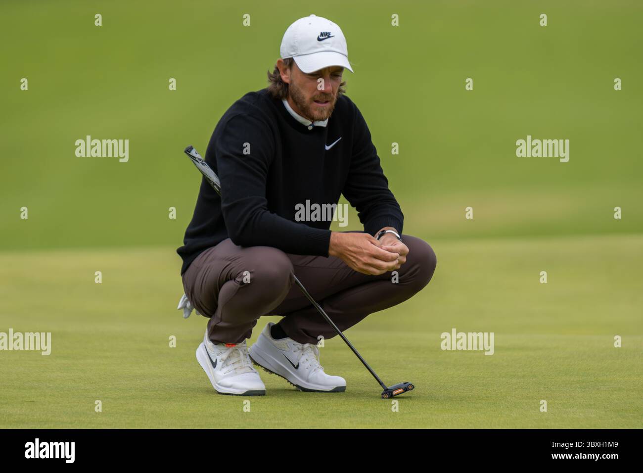 Portrush, Ireland. 18th July 2025. Tommy Fleetwood over a bird putt ...
