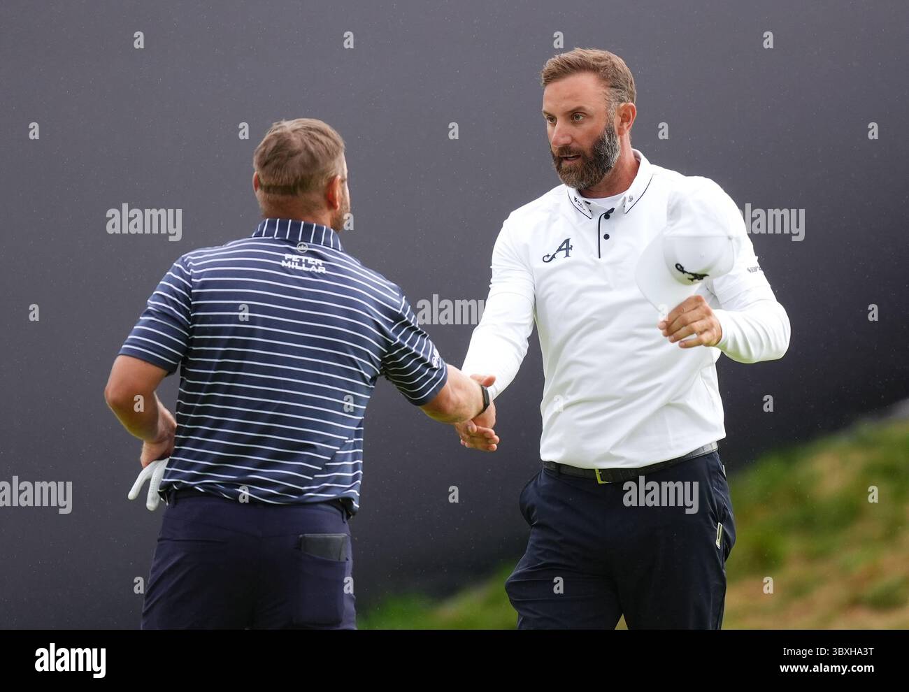 England's Jordan Smith shakes hands with USA's Dustin Johnson on thr ...
