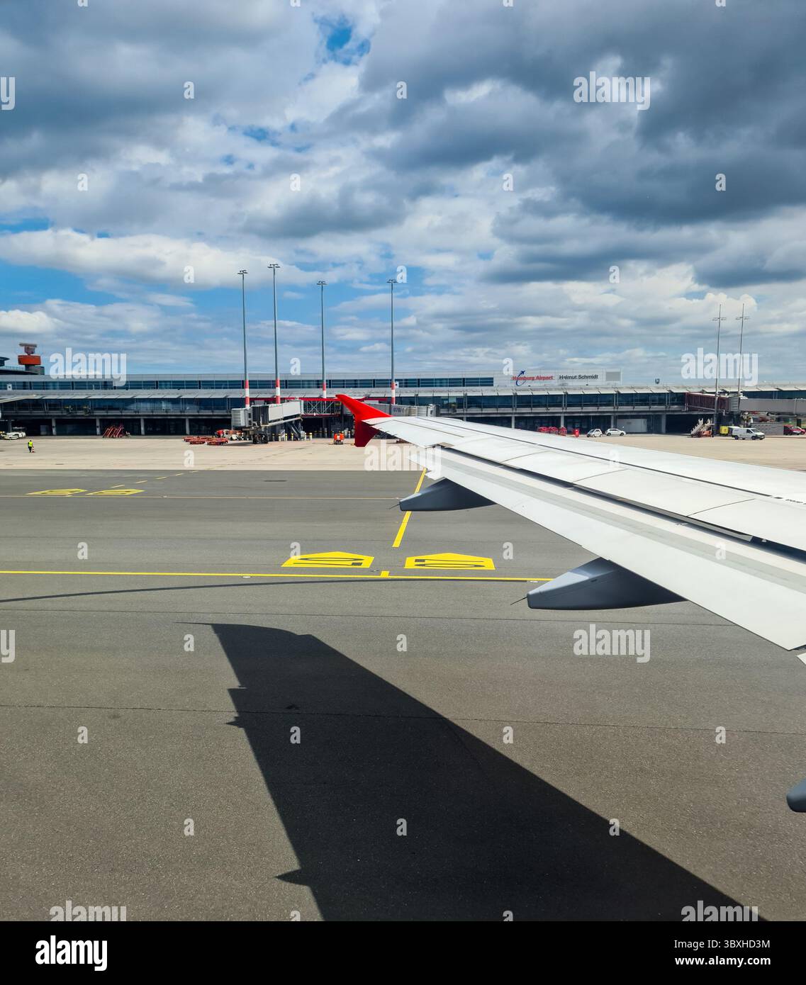 Hamburg, Germany - 10. July 2025: Airplane wing casting shadow on ...