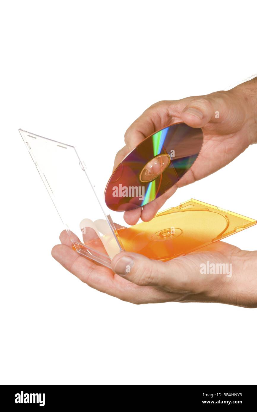 Men's hand holding DVD CD disc isolated on white background Stock Photo ...