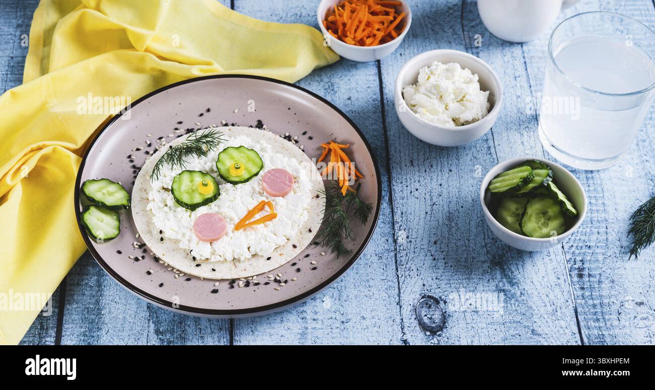 Food, Face made of tortilla, cottage cheese, sausages, vegetables for ...