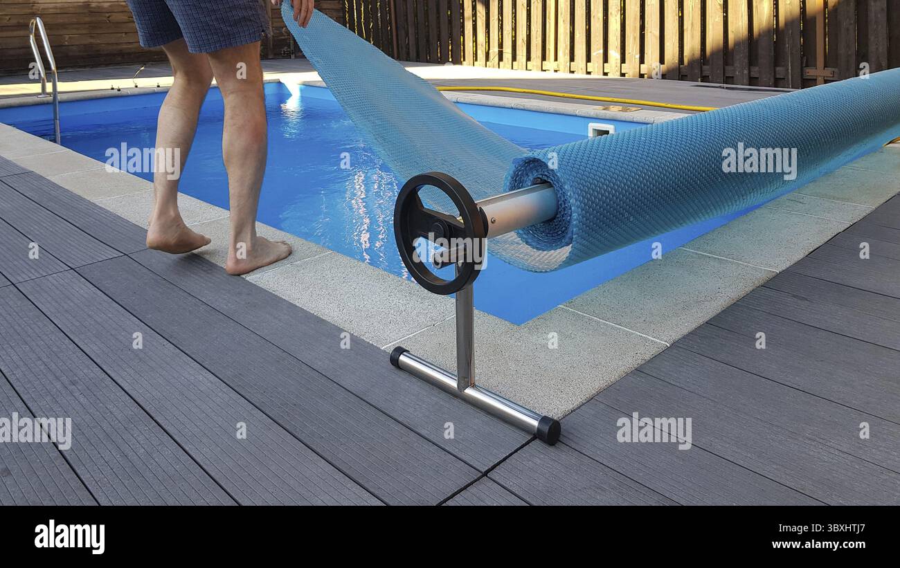 Man covers swimming pool hi-res stock photography and images - Alamy