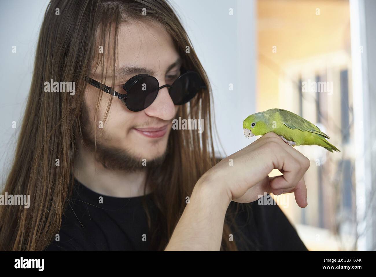 Guy long hair communicates hi-res stock photography and images - Alamy