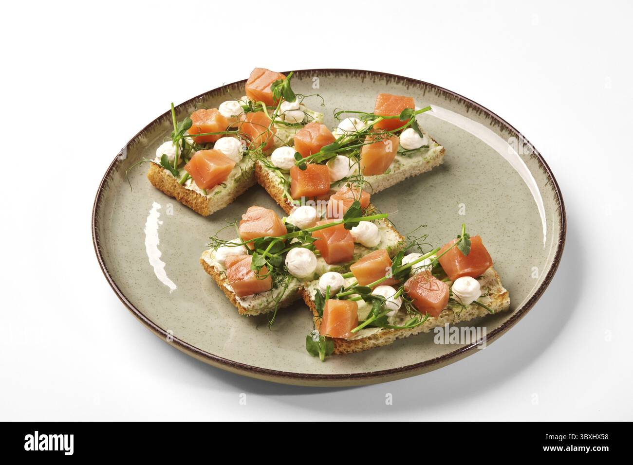Appetizing bruschettas with salmon gravlax, mozzarella and cream cheese ...