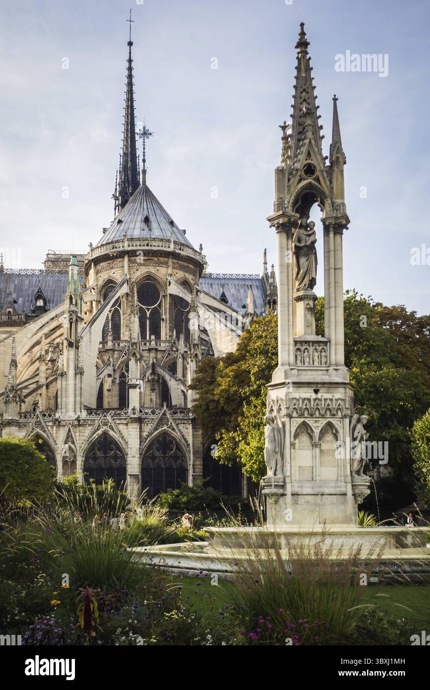 The back of Notre Dame Cathedral from the park in summer in Paris ...