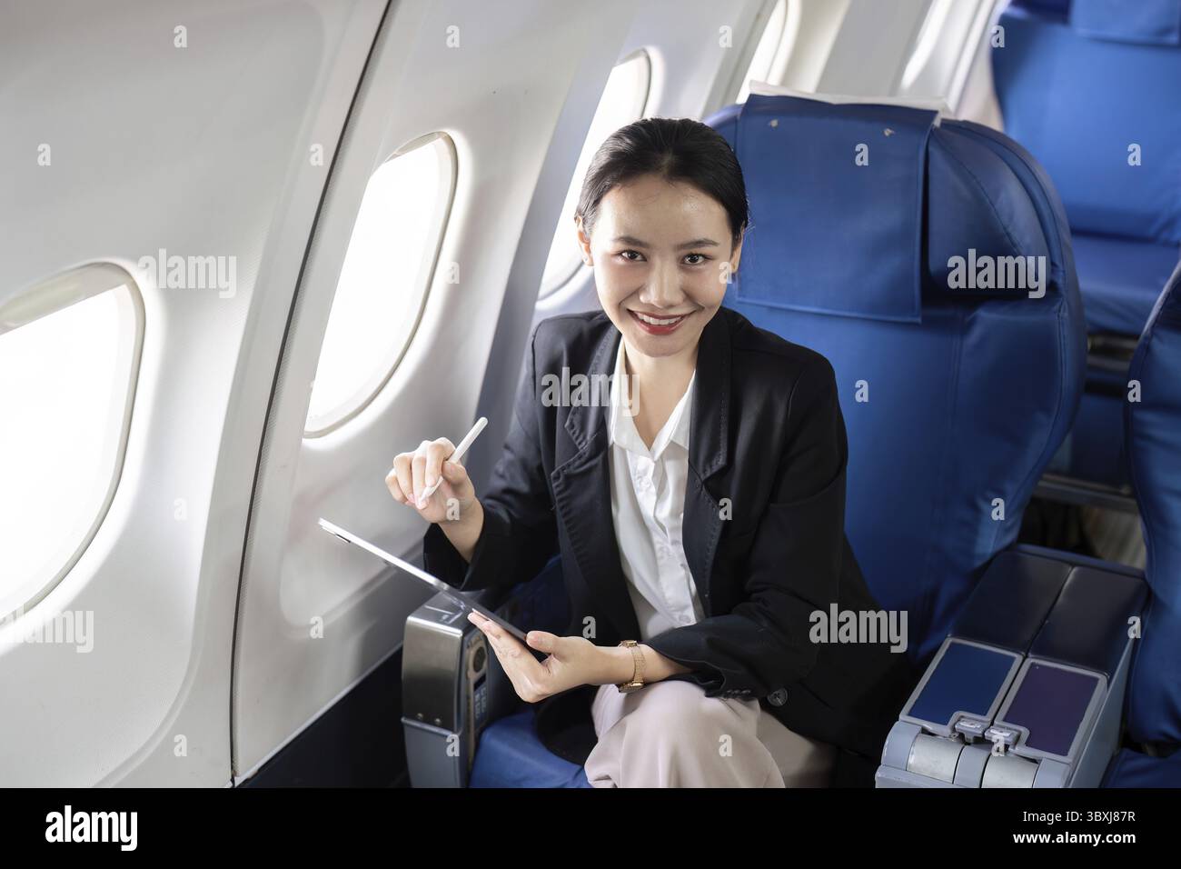 Woman sits in business class hi-res stock photography and images - Alamy