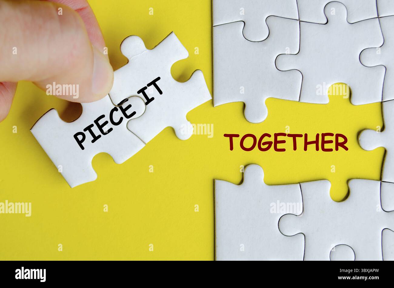 Piece it together text on missing jigsaw puzzle representing teamwork ...