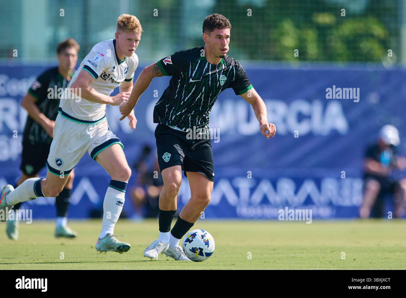 MURCIA, SPAIN - JULY 18: Luis Roldan of Elche CF passes the ball during ...