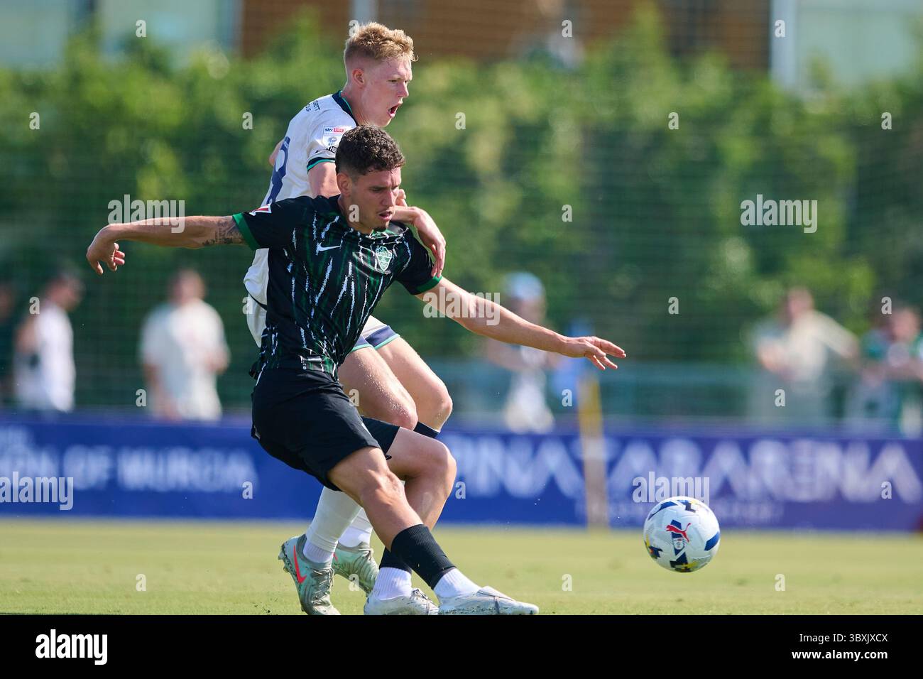 MURCIA, SPAIN - JULY 18: Luis Roldan of Elche CF passes the ball during ...