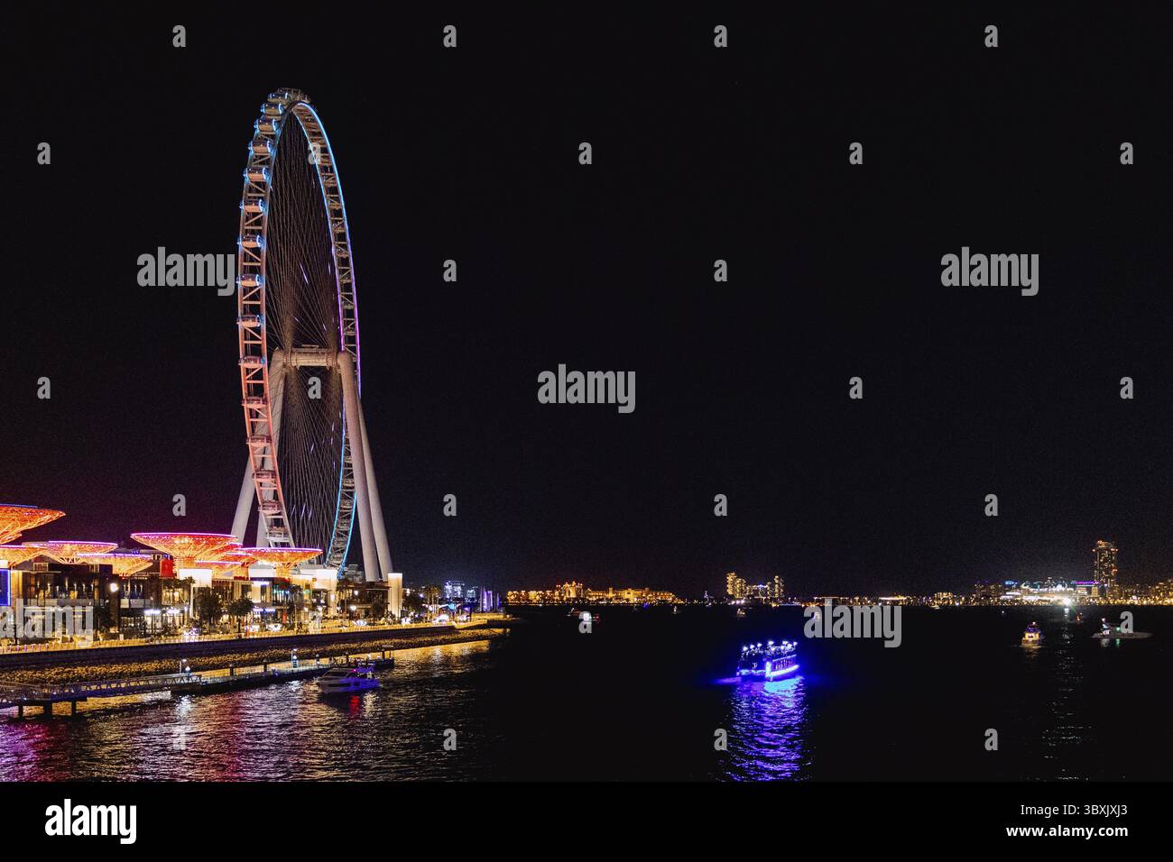 Panoramic view of Bluewaters Island at night. Famous Ain Dubai ...