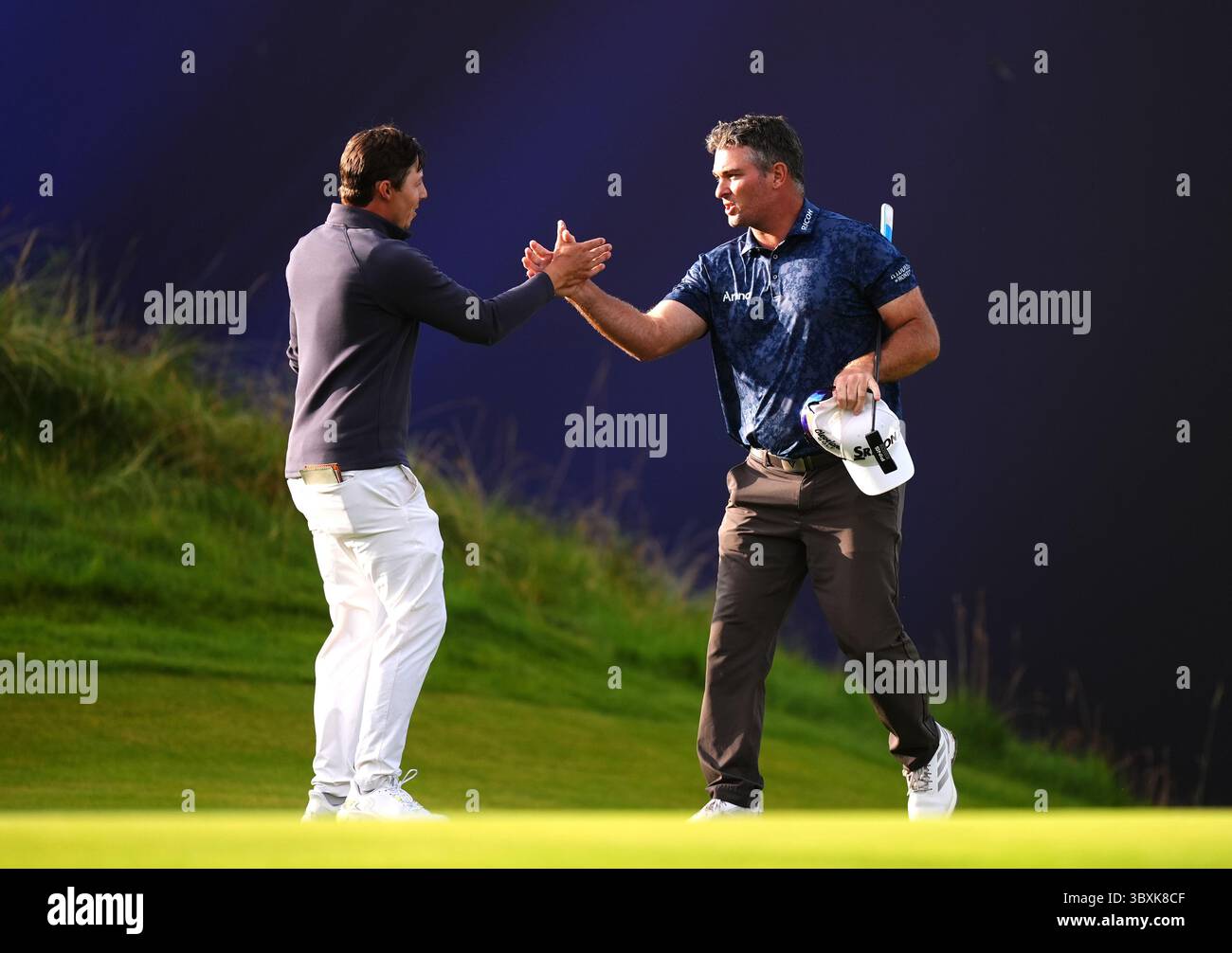 England's Matt Fitzpatrick shakes hands with New Zealand's Ryan Fox on ...