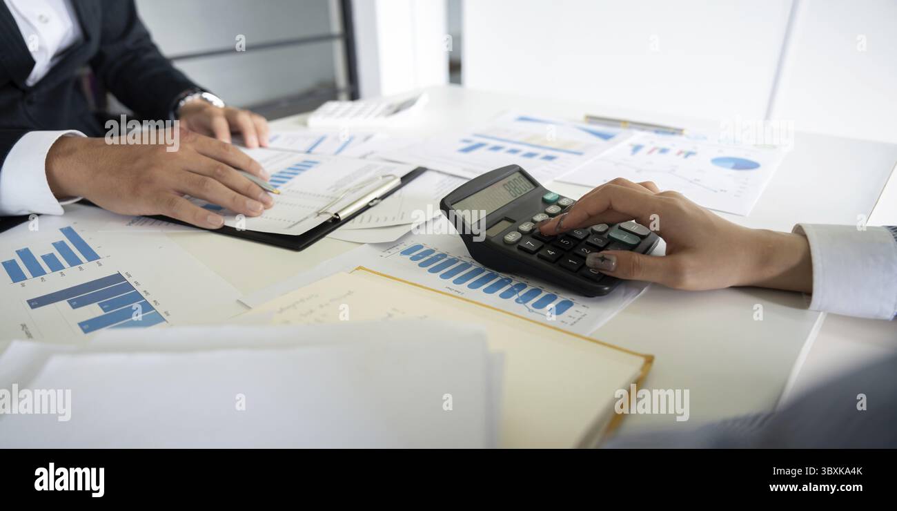 Business team analyzing income chart and graph in office. Close up ...