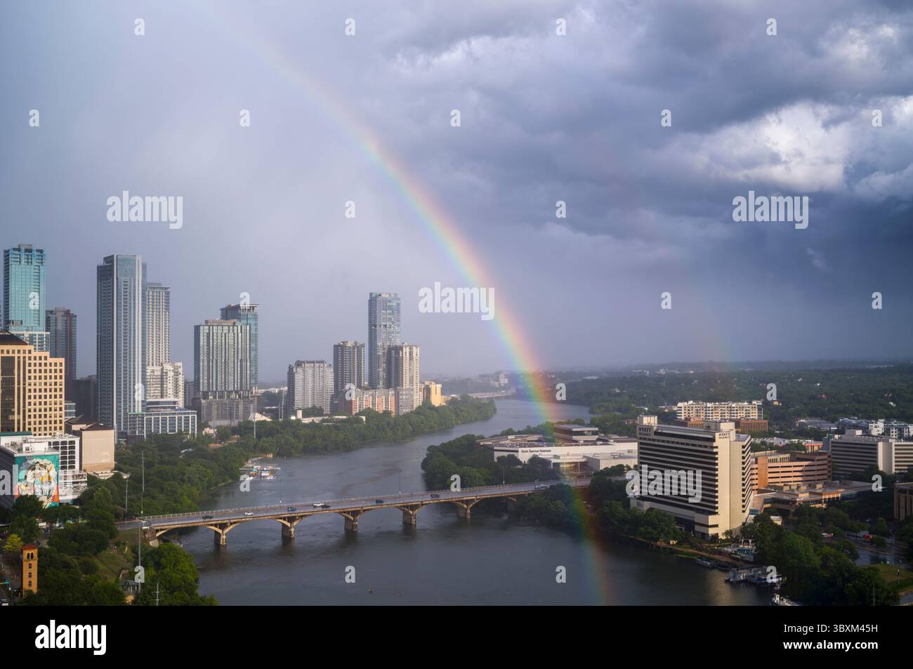 Rainey Street Austin Texas skyline with rainbow over Ladybird Lake and ...