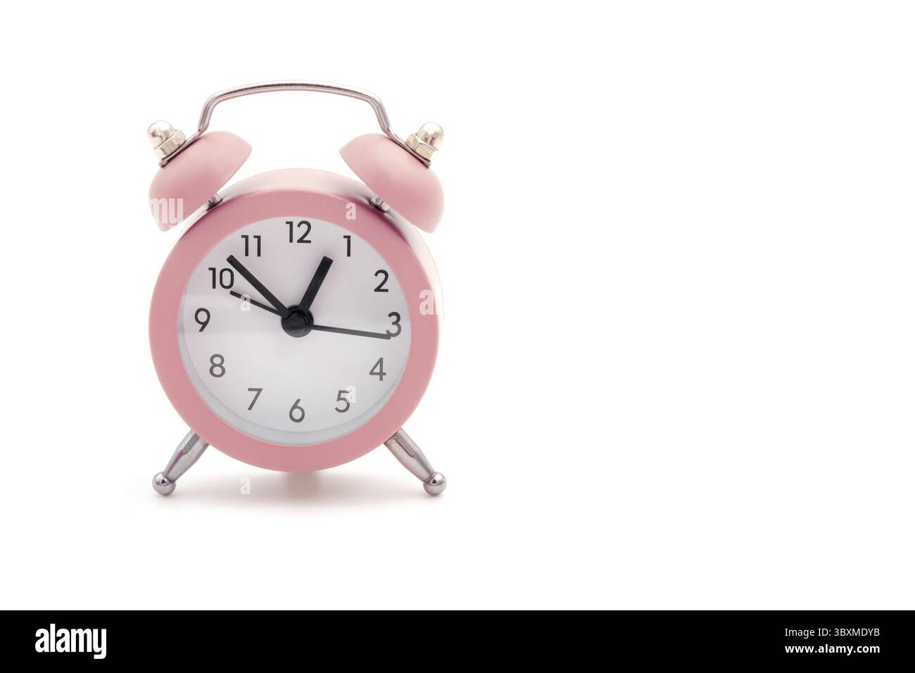 Classic pink table clock on a white background Stock Photo - Alamy