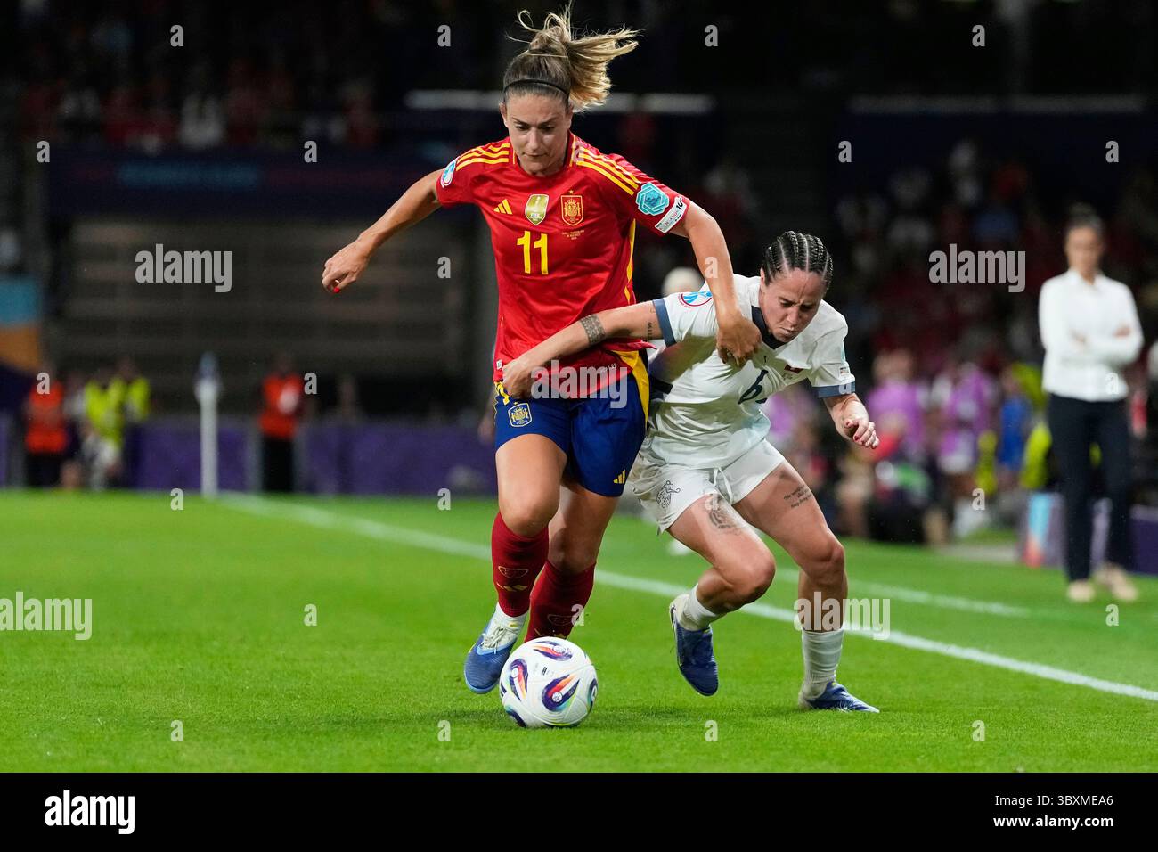 Switzerland's Geraldine Reuteler fights for the ball with Spain's ...