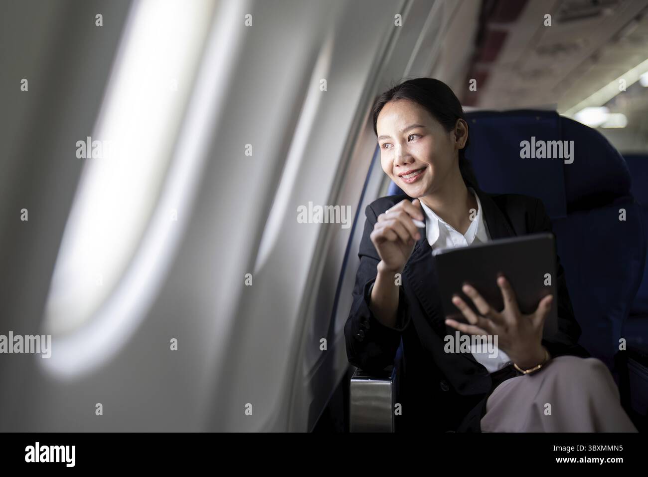 Woman sits in business class hi-res stock photography and images - Alamy