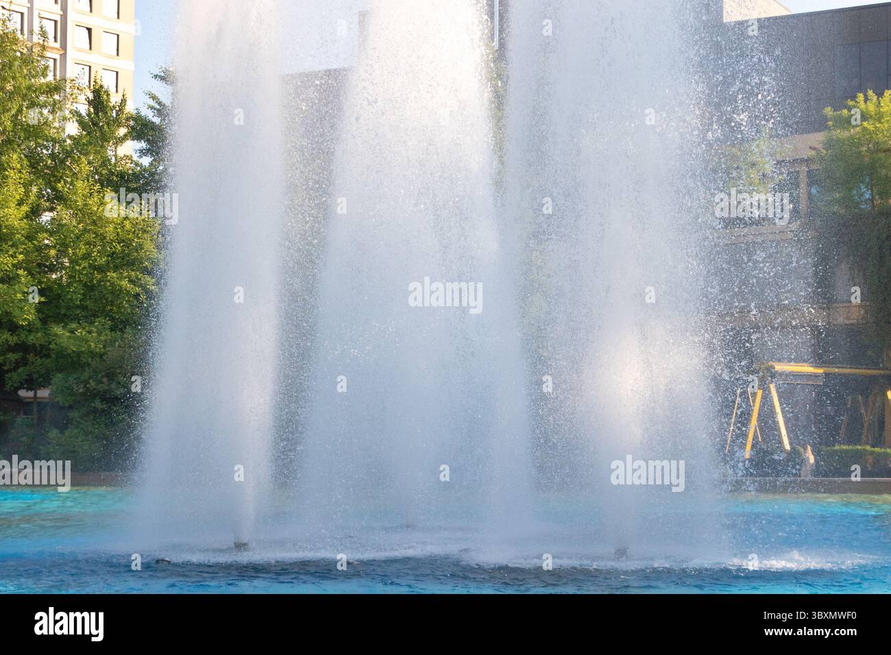 Towering Water Columns Erupting from Vibrant Blue Fountain Pool Stock ...