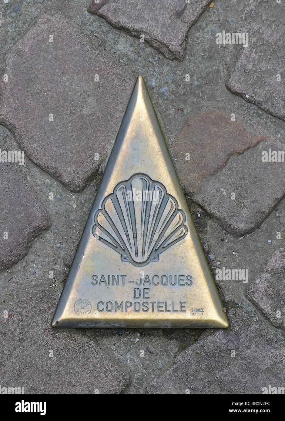A bronze scallop shell ground marker on the Camino de Santiago in Saint ...