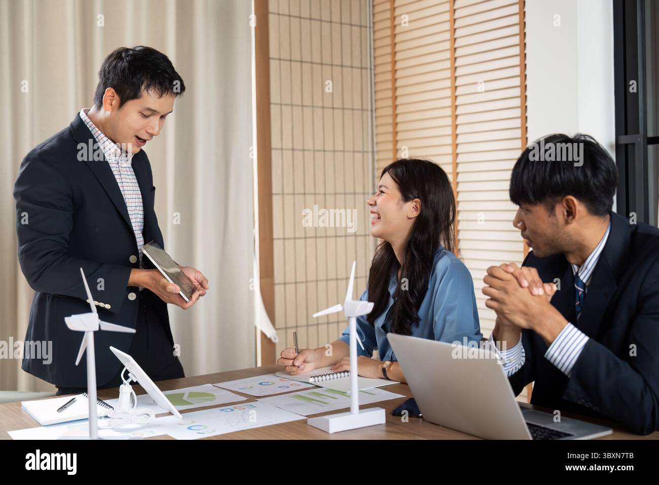 Collaborative ESG Discussion: Team Engaging in Sustainable Solutions Stock Photo - Alamy