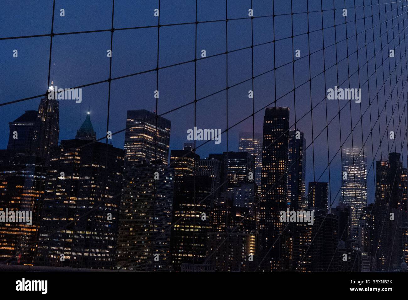 Dusk descends on a bustling metropolis, viewed through the iconic ...