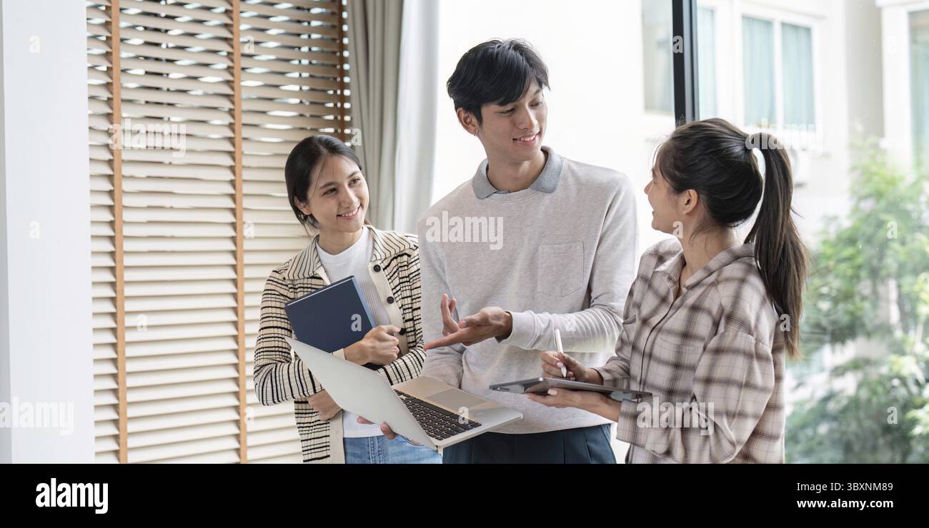Three students engaged in a lively discussion, sharing ideas and ...