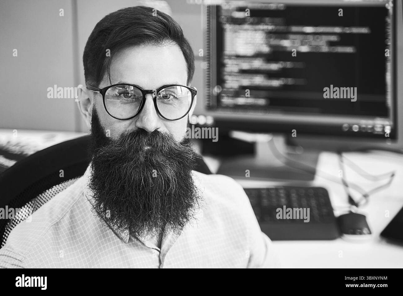 Serious male working computer Black and White Stock Photos & Images - Alamy